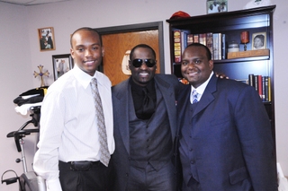 Singer Johnny Gill with Timothy Carter left and Daniel Carter following ...