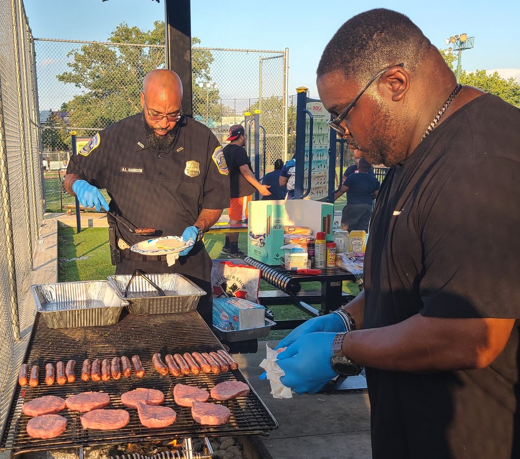 Veteran D.C. Police Officers Marcus Thomas and A.I. Harrison serve hot ...